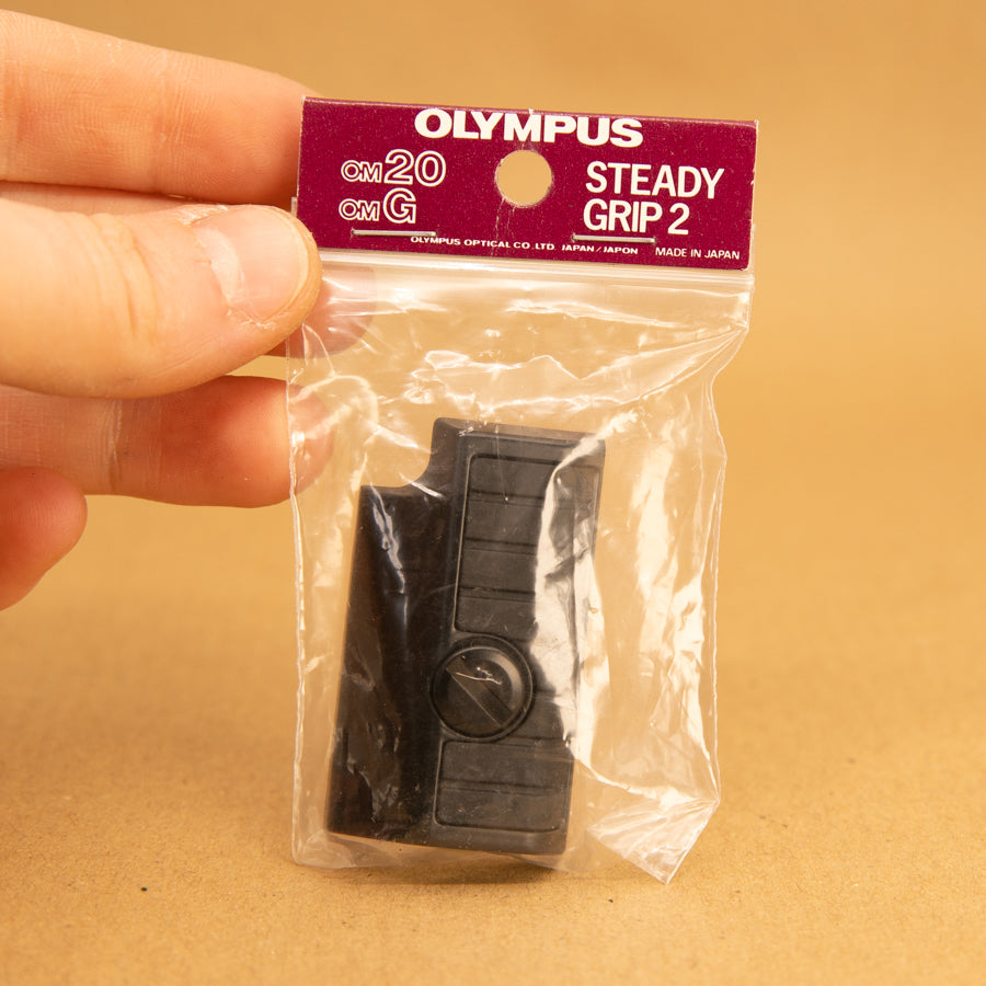 Genuine Olympus OM20 and Olympus OMG Steady Grip 2 – Cameras By Max Ltd